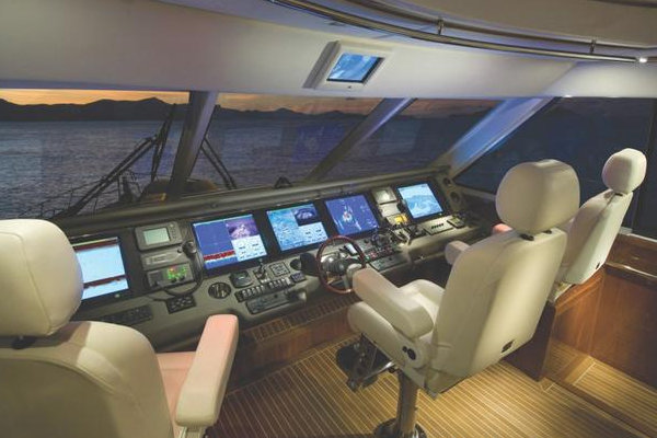 The 75 Enclosed Flybridge helm features comprehensive electronic ...