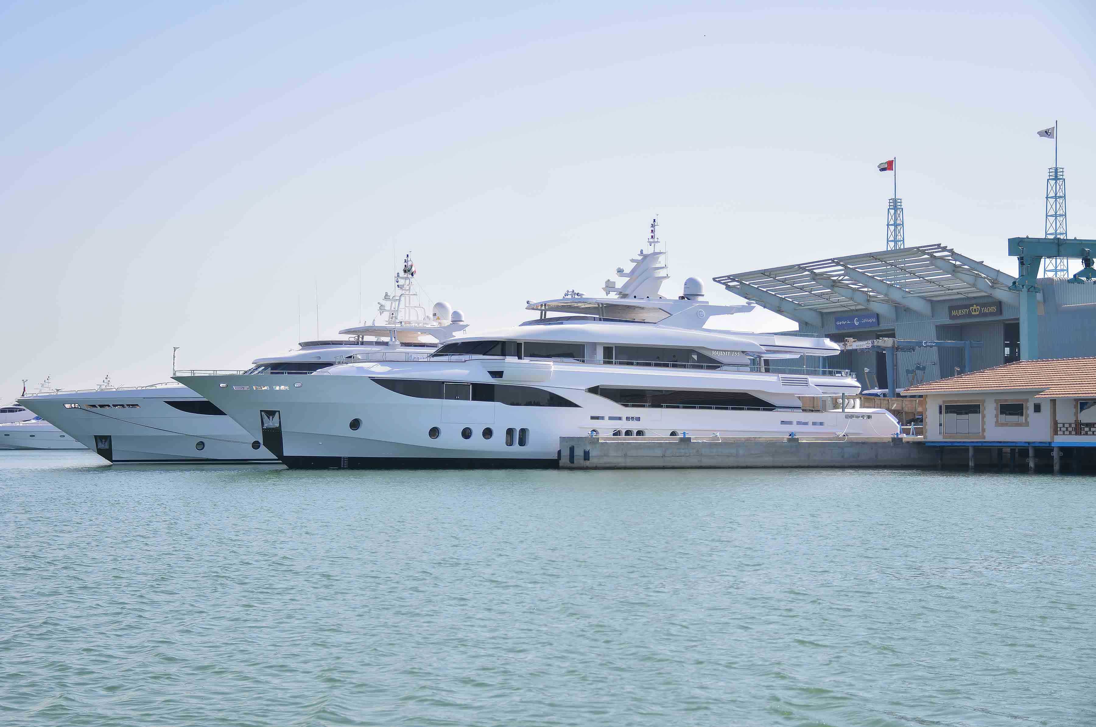 Majesty 155 Yacht in the water next to superyachts Majesty 135 and ...