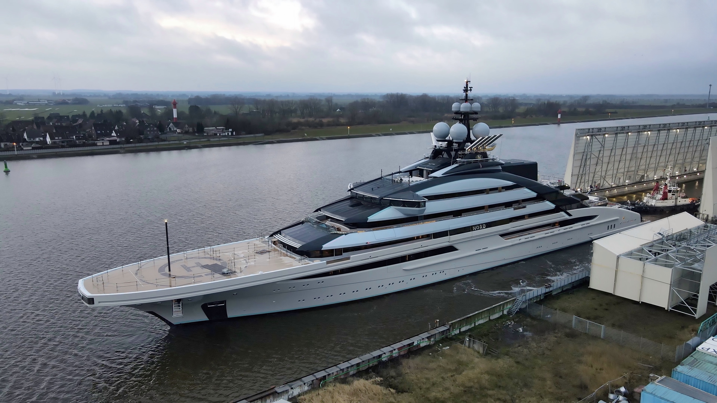 Aerial view of the 142 m superyacht NORD floating out of shipyard ...